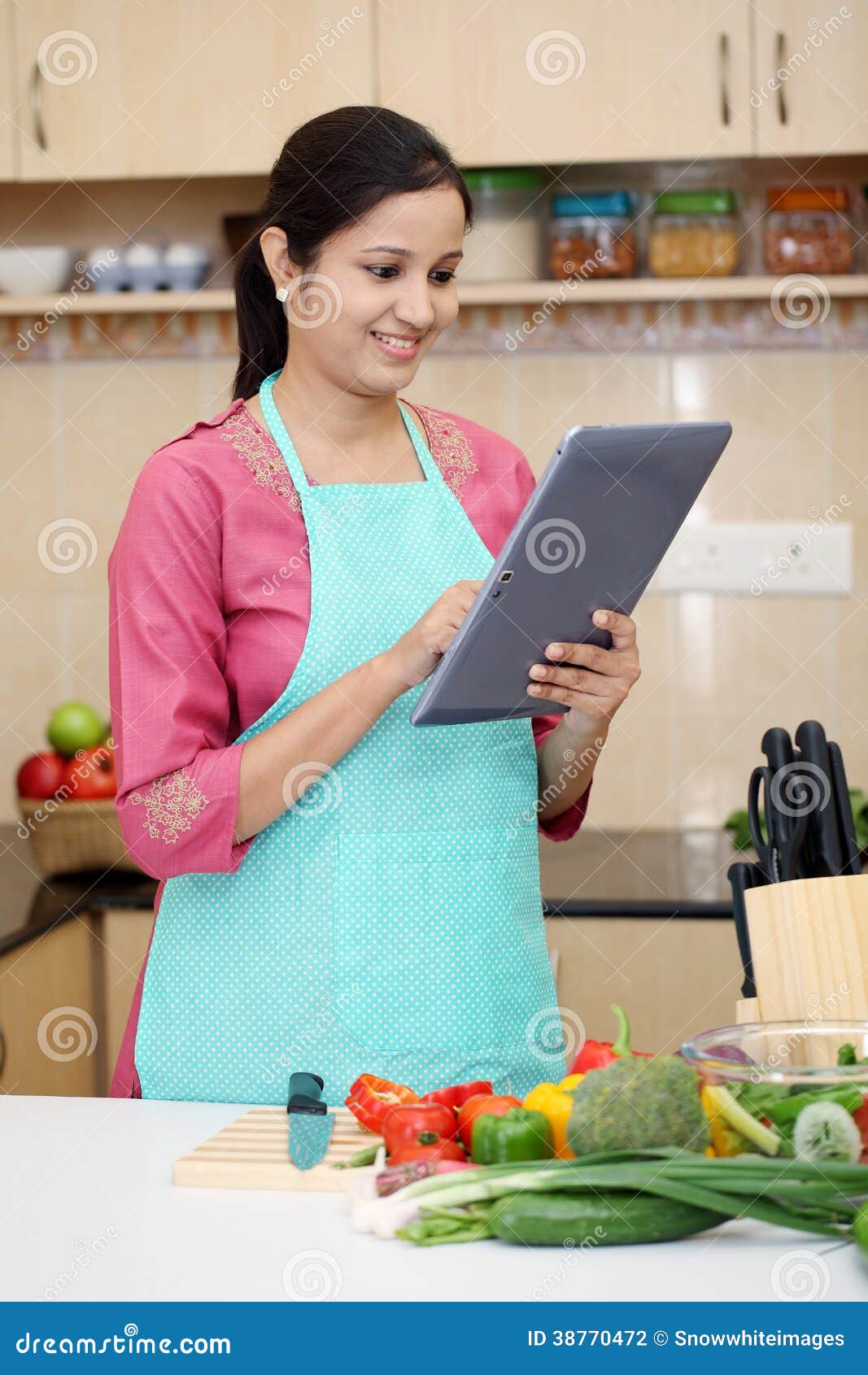 Woman Using Computer in Her Kitchen Stock Photo - Image of female ...