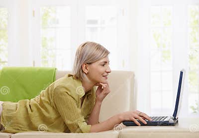 Woman Using Computer at Home Stock Image - Image of alone, color: 27720821