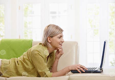 Woman Using Computer at Home Stock Image - Image of alone, color: 27720821