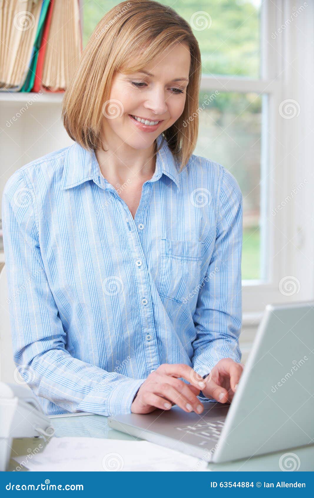 Woman Using Computer in Home Office Stock Photo - Image of smiling ...