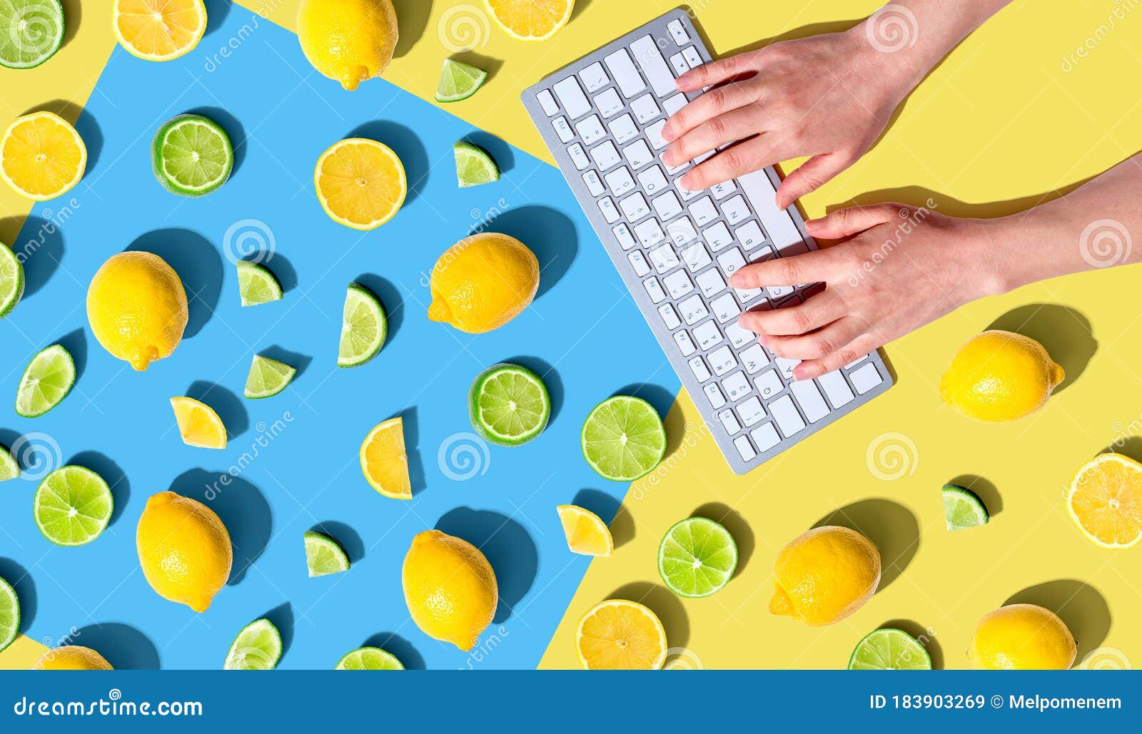 Woman Using a Computer Keyboard with Fresh Lemons and Limes Stock Image ...