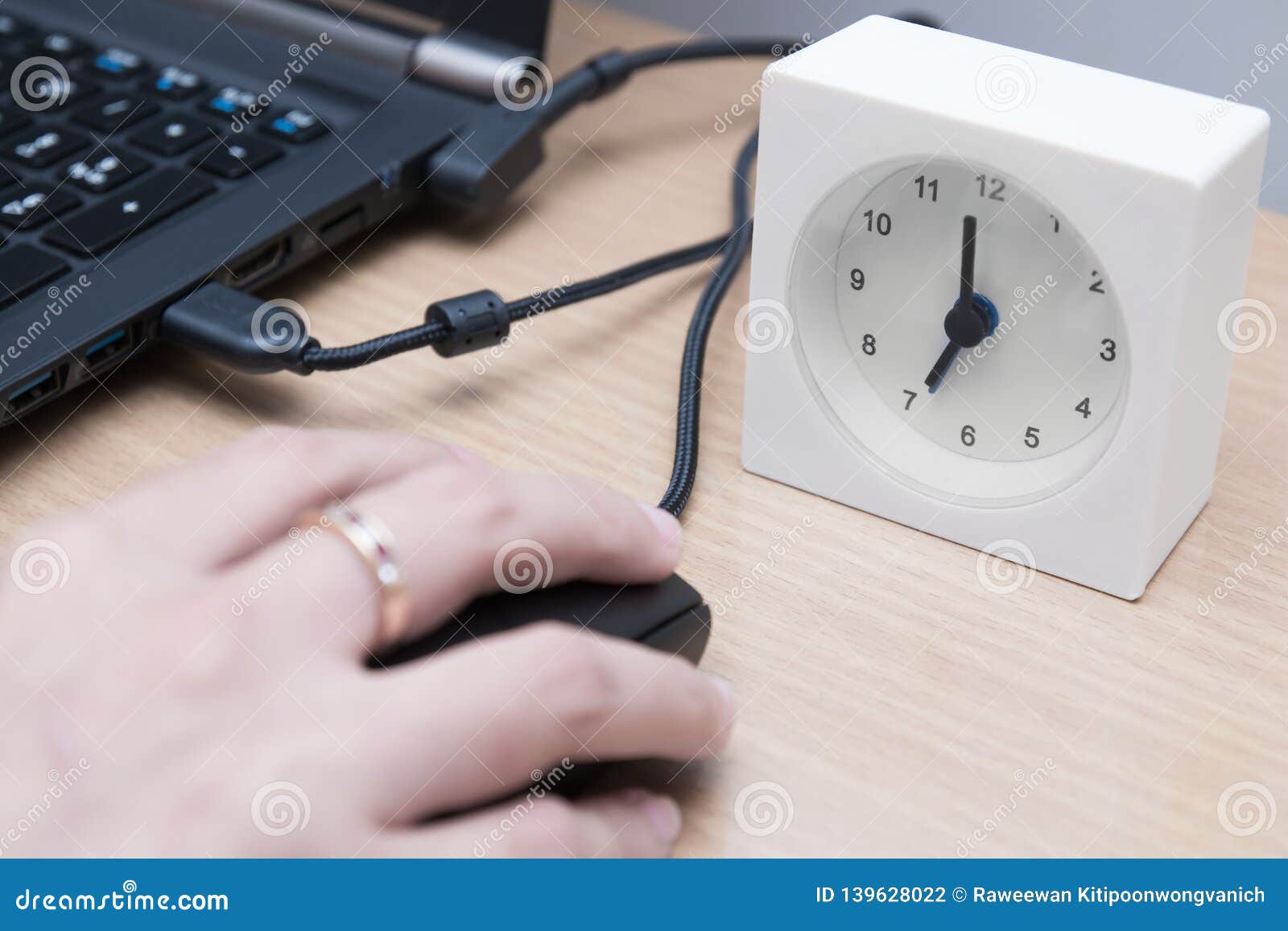 Woman Using Computer Mouse with Laptop and White Clock on the Table ...