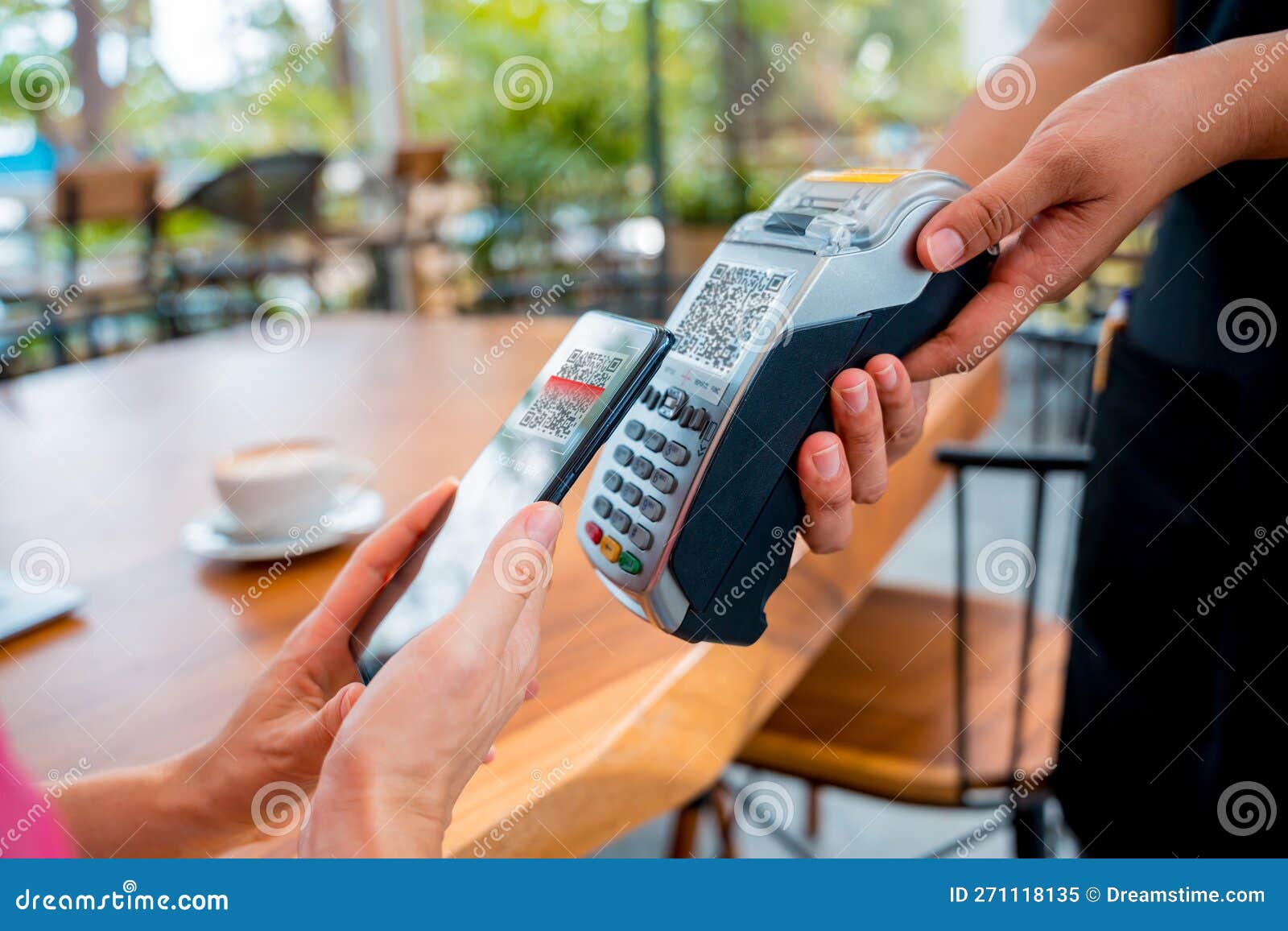 Woman Using Contactless Payment by Mobile Phone with QR Code at Cafe ...