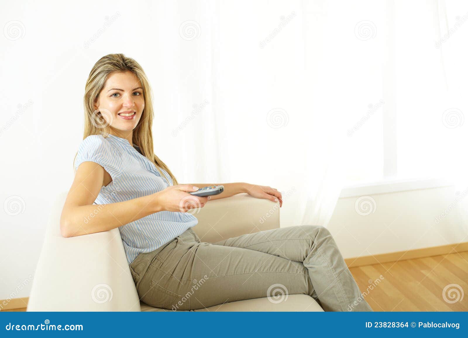 Woman Using a Control Remote Stock Photo - Image of life, couch: 23828364