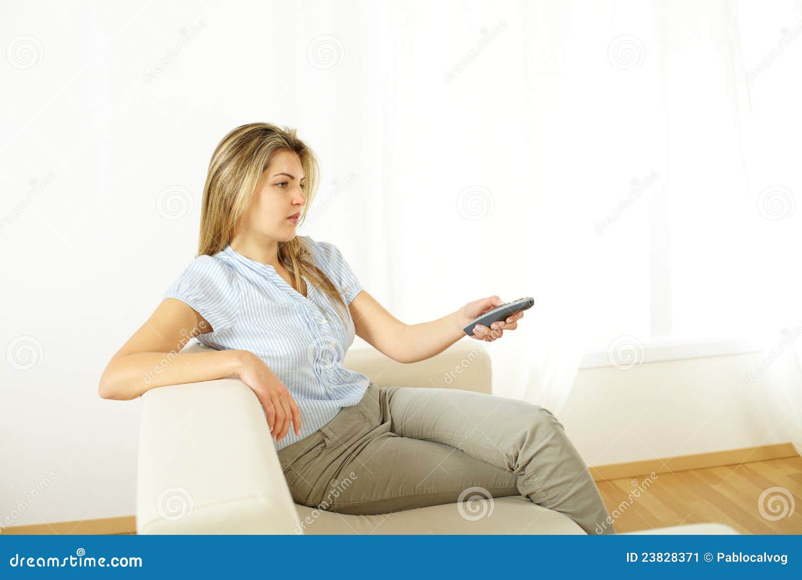Woman Using a Control Remote Stock Image - Image of beauty, carefree ...