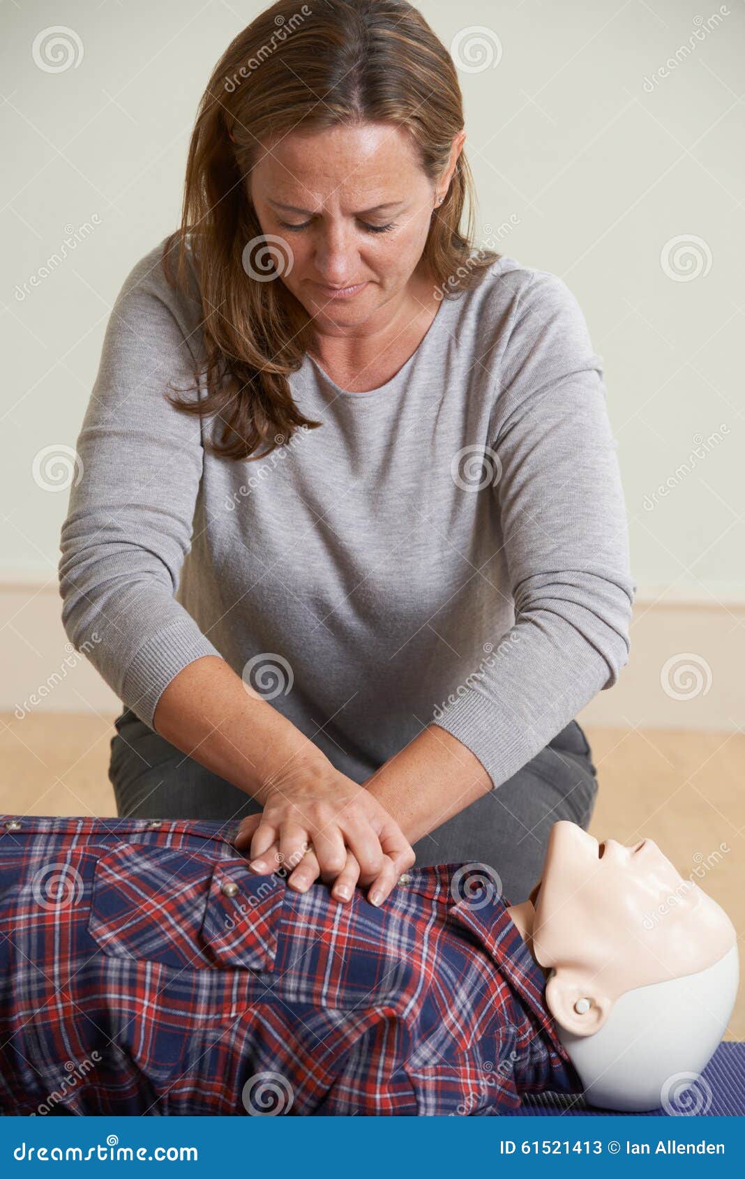 Woman Using CPR Technique on Dummy in First Aid Class Stock Image ...