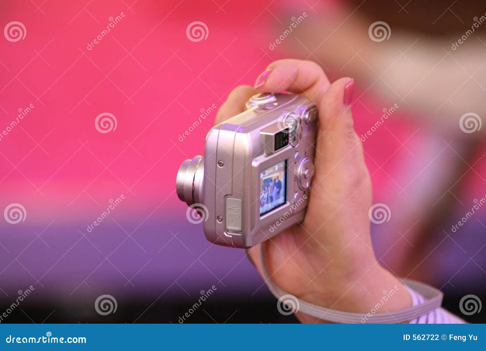 Woman using digital camera stock photo. Image of metal - 562722