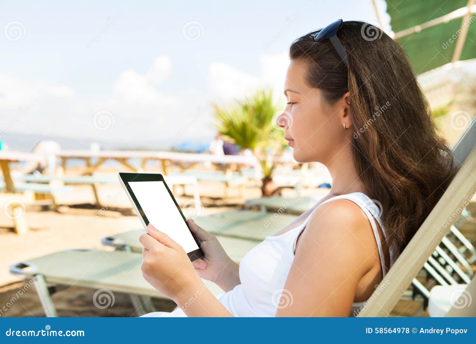 Woman Using Digital Tablet at Beach Stock Photo - Image of ...