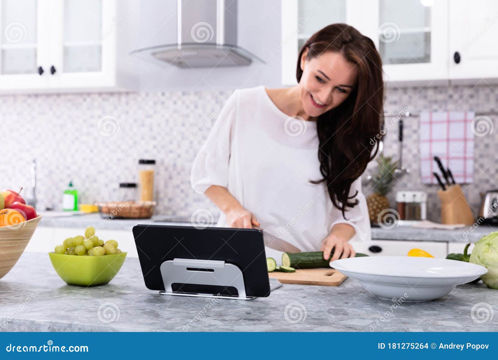 Woman Using Digital Tablet while Cooking Food Stock Photo - Image of ... Woman Using Digital Tablet while Cooking Food Stock Photo - Image of ...