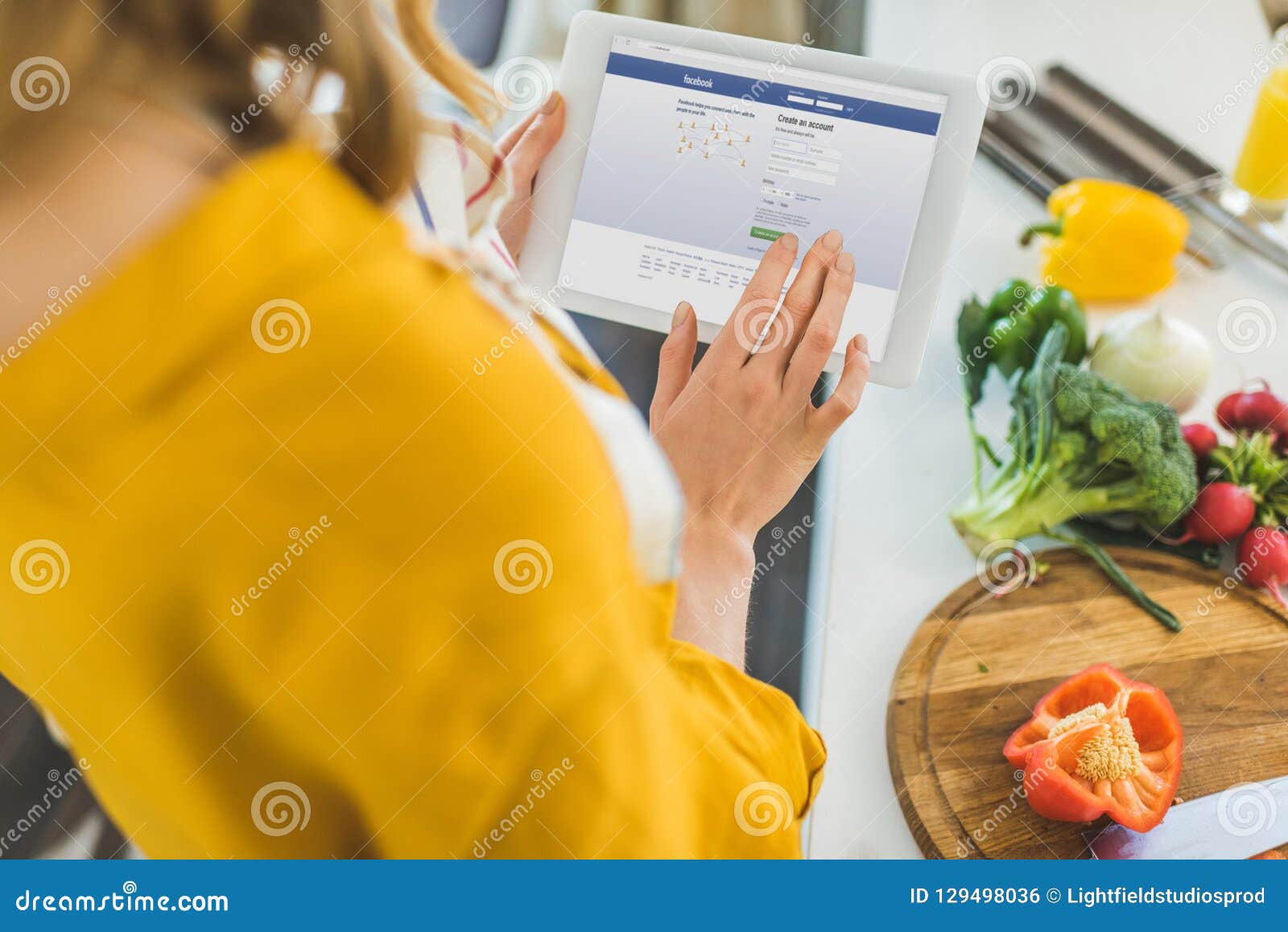Woman Using Digital Tablet in Kitchen for Recipe Editorial Photo ...