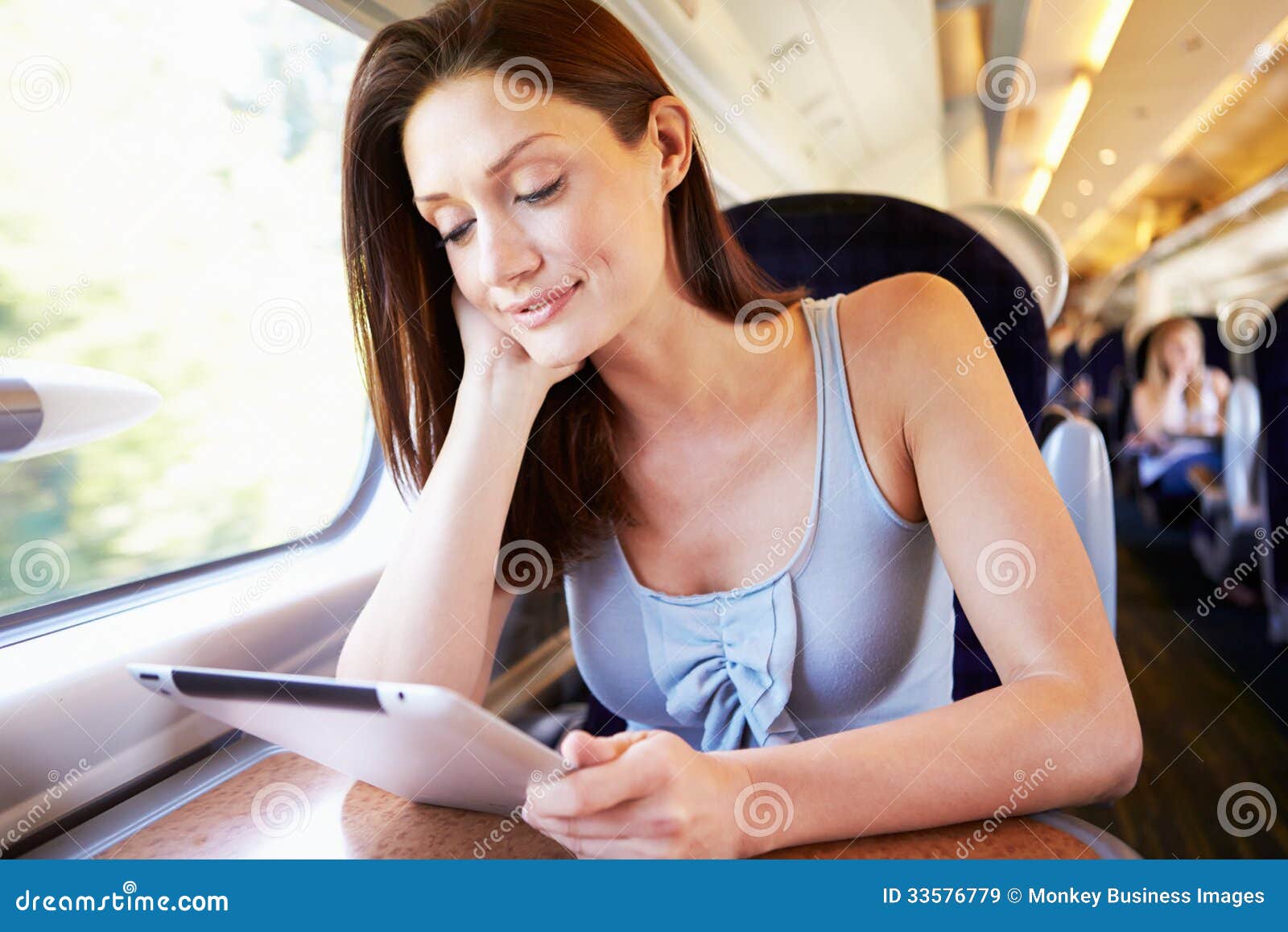 Woman Using Digital Tablet on Train Stock Image - Image of female ...