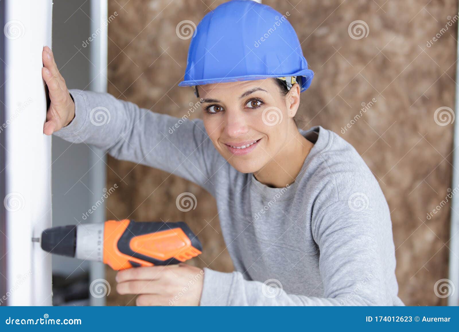 Woman using drill stock image. Image of repair, renovation - 174012623