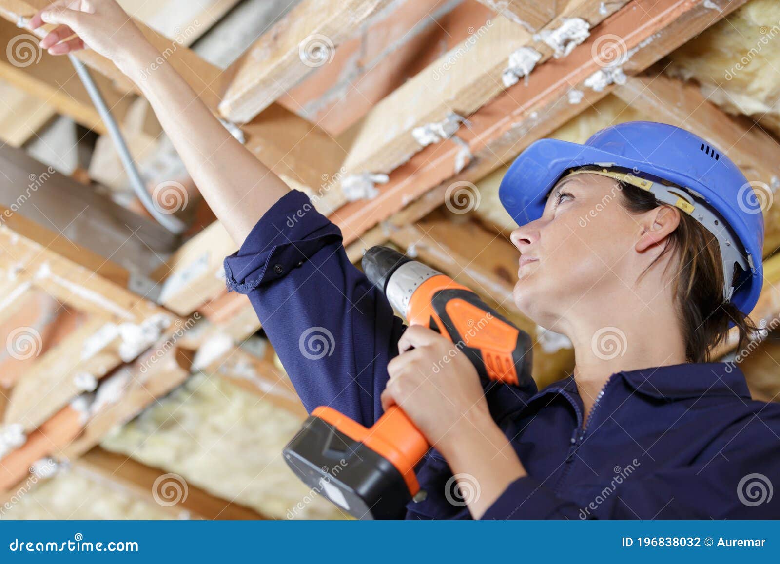Woman using drill stock photo. Image of concentration - 196838032
