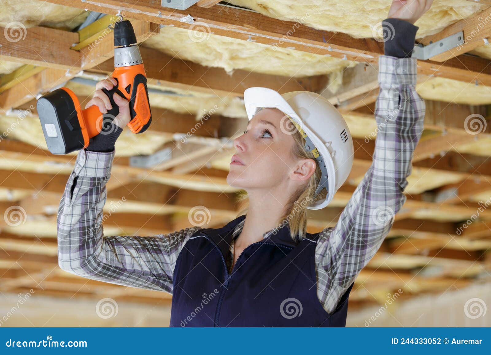 Woman Using Drill on Indoor Construction Site Stock Photo - Image of ...