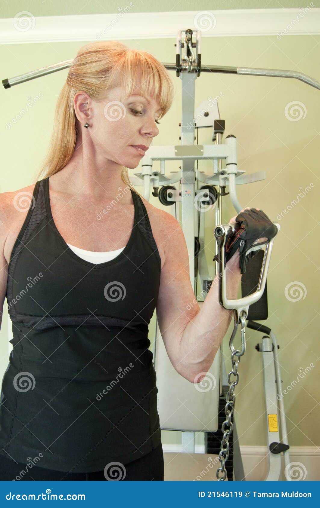 Woman Using Exercise Equipment Stock Image - Image of fitness, curl ...