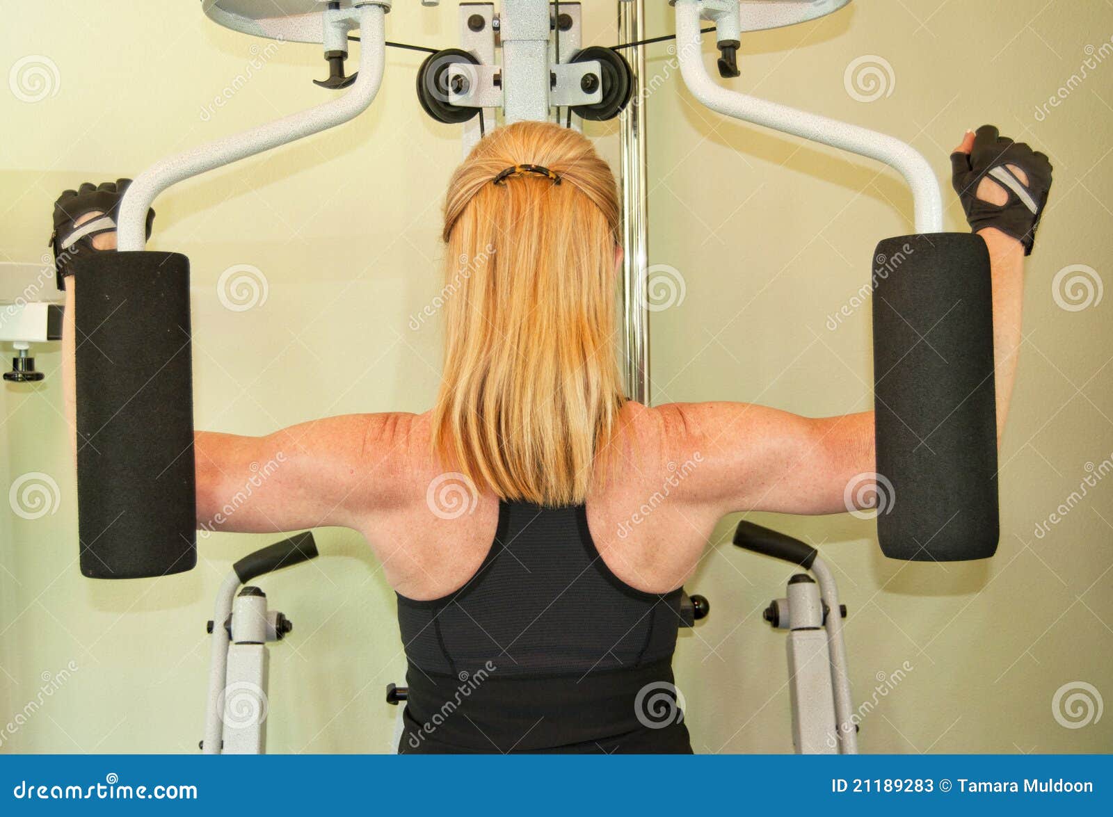 Woman Using Exercise Machine Stock Image - Image of machine, exercise ...
