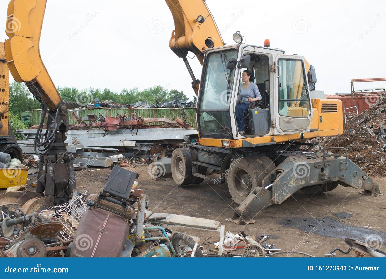 Woman Using Grabber in Scrapyard Stock Image - Image of platform, plant ...