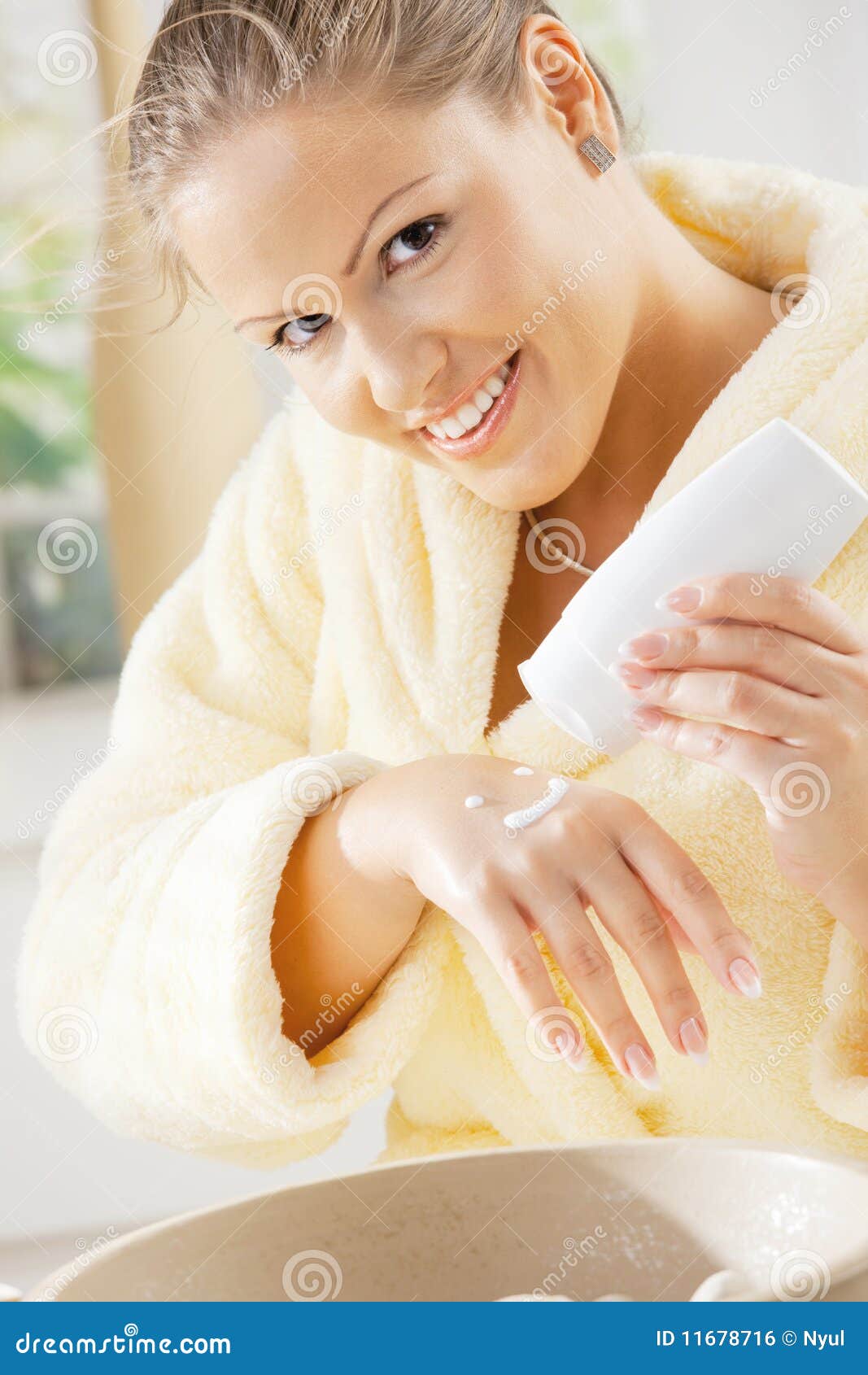 Woman using hand cream stock photo. Image of bathroom - 11678716