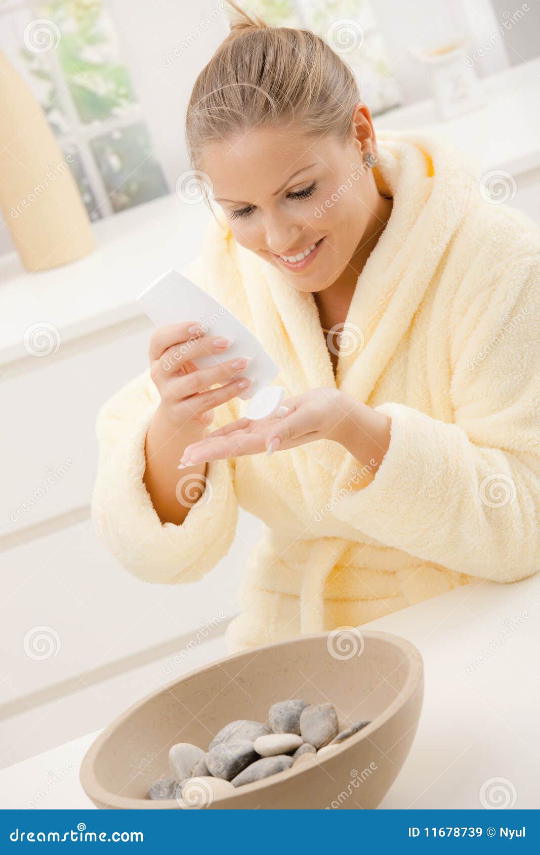 Woman using hand cream stock image. Image of hair, bathrobe - 11678739
