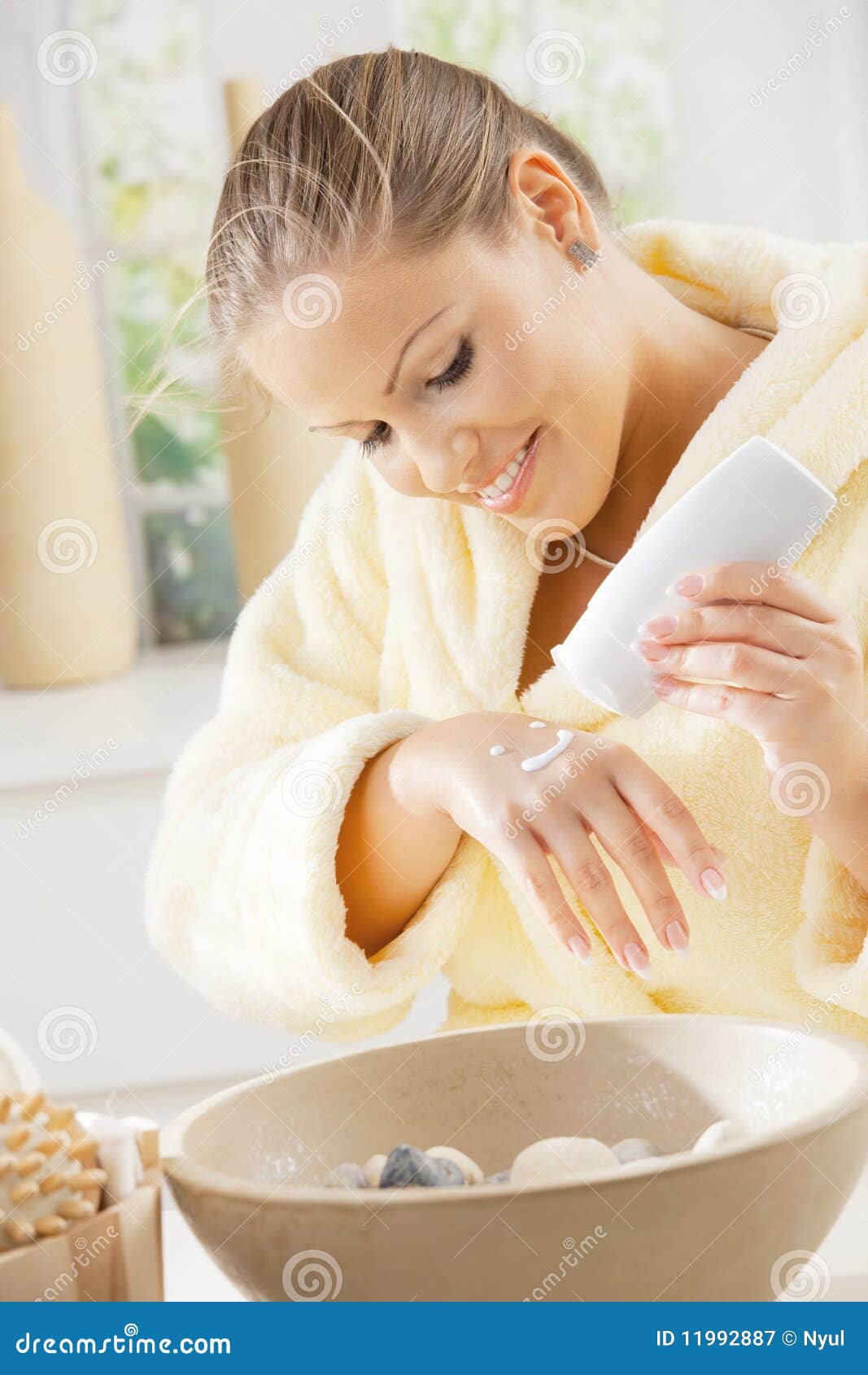 Woman using hand cream stock image. Image of cheerful - 11992887