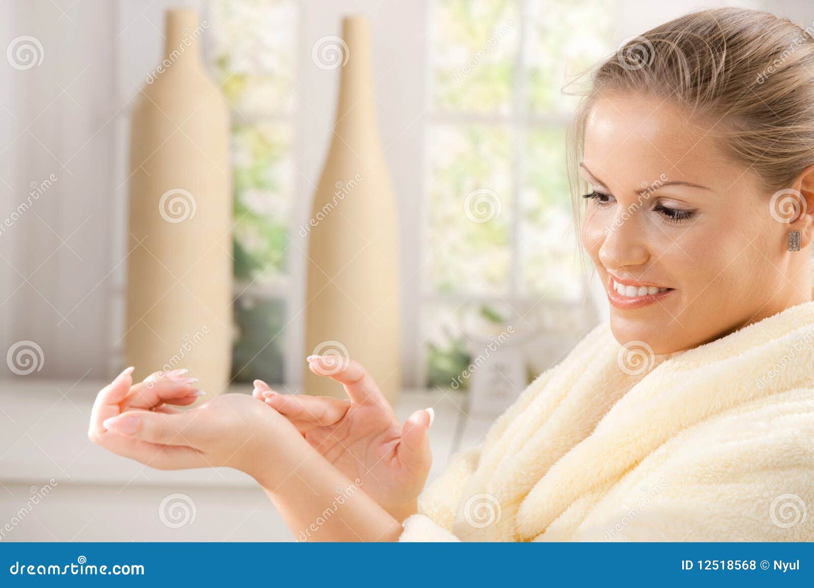 Woman using hand cream stock photo. Image of hand, clear - 12518568