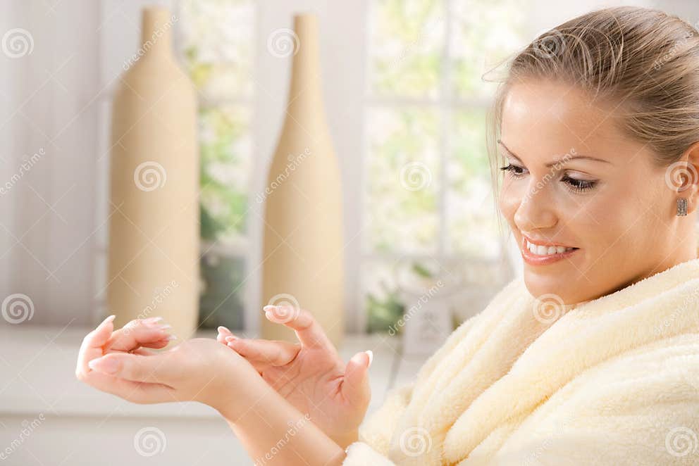 Woman using hand cream stock photo. Image of hand, clear - 12518568