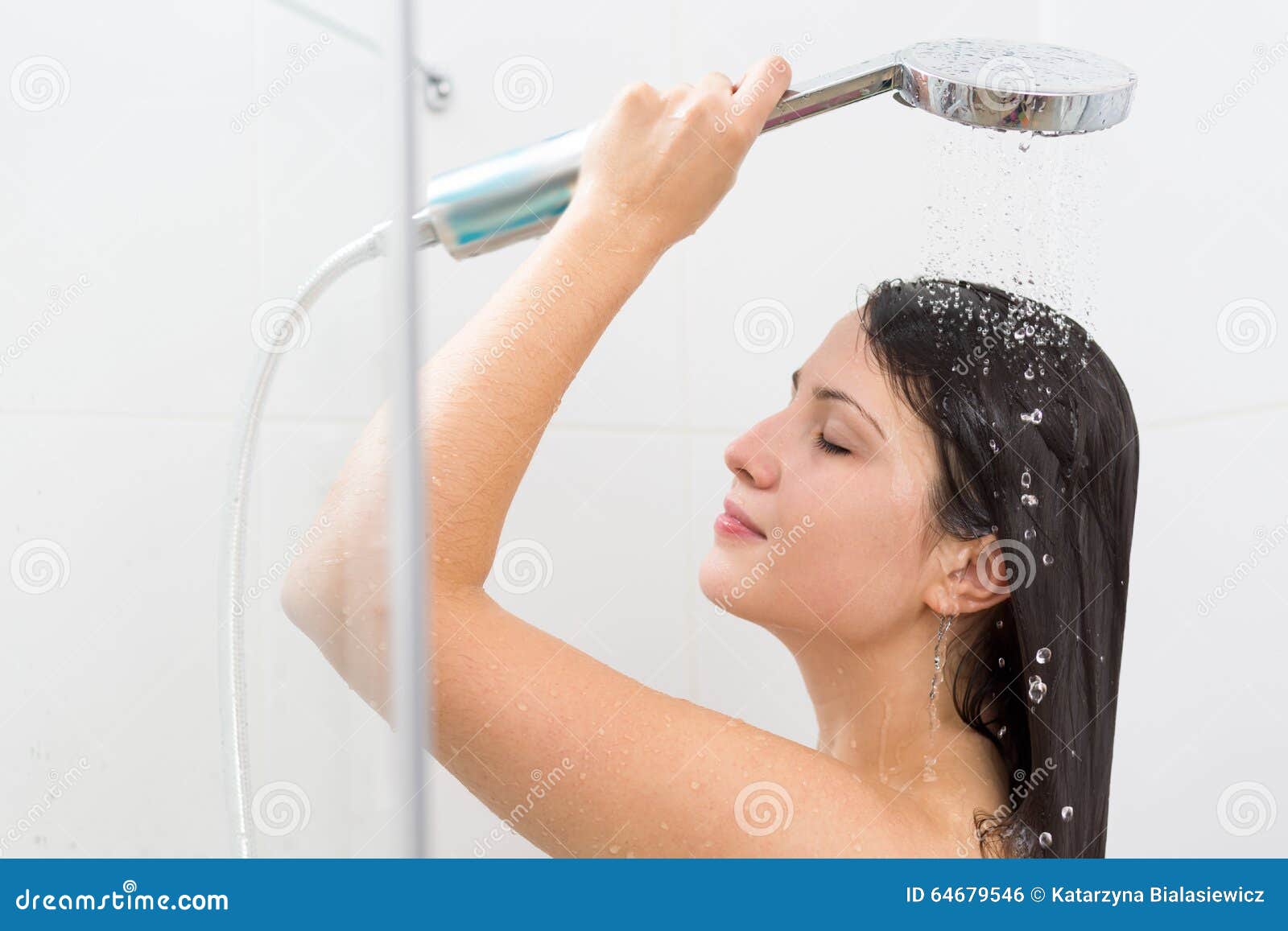 Woman using hand shower stock photo. Image of bath, showering - 64679546