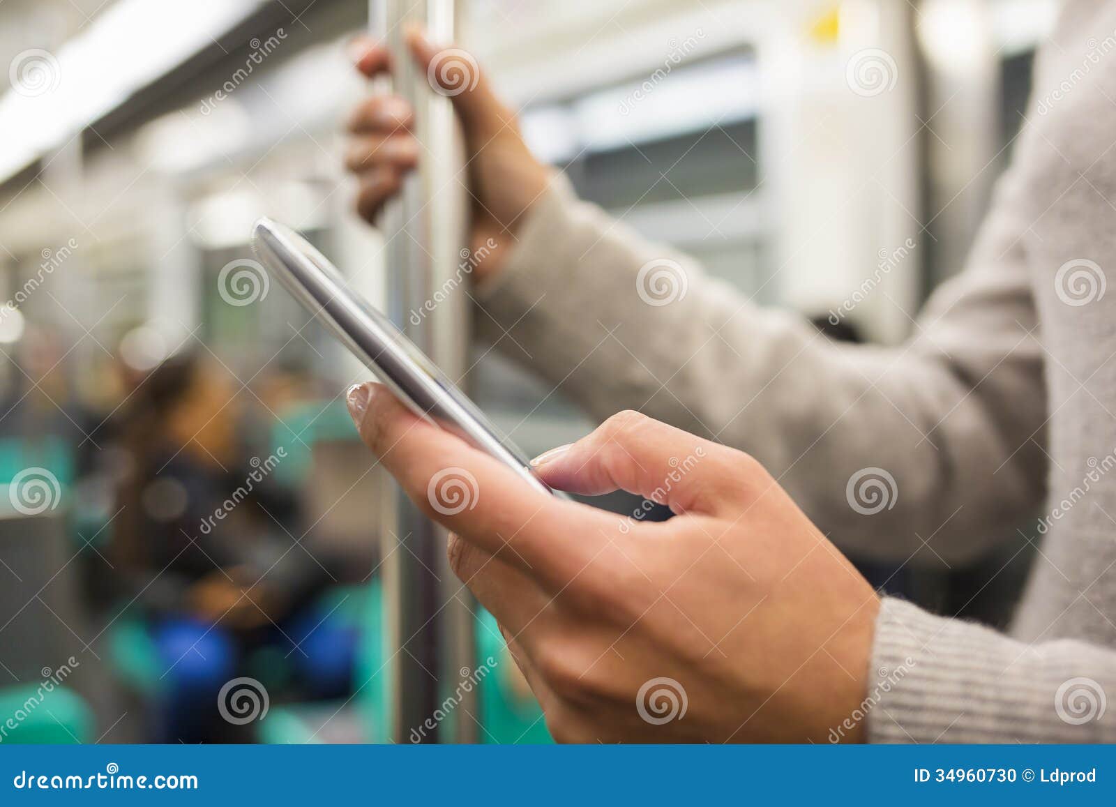 Woman Using Her Cell Phone in Subway Stock Photo - Image of group ...