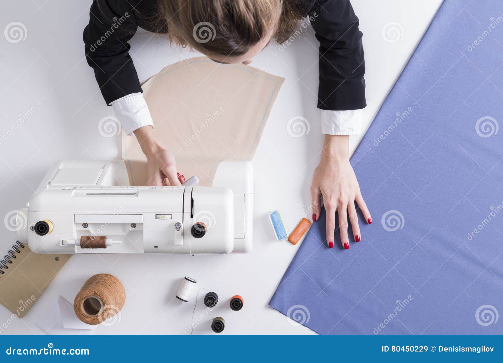Woman Using Her Sewing Machine and Touching Material Stock Image ...