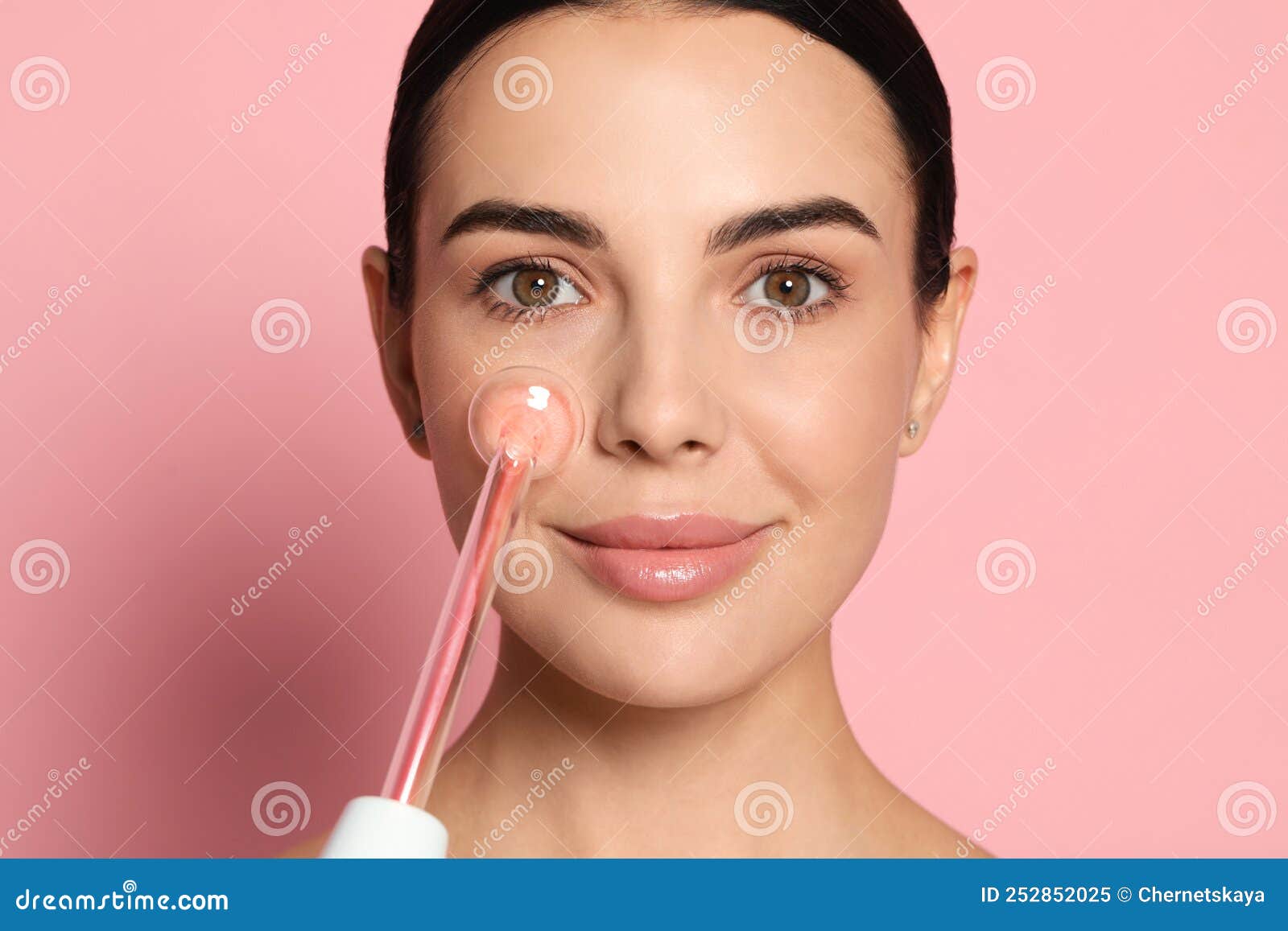 Woman Using High Frequency Darsonval Device on Pink Background Stock ...