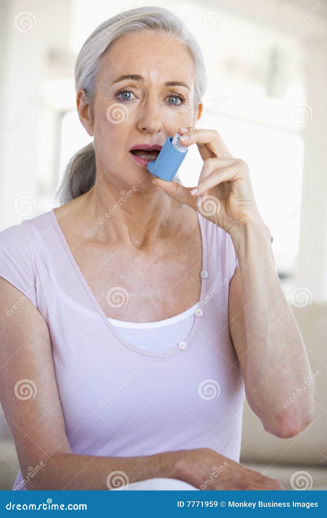 Woman Using an Inhaler stock image. Image of asthma, inside - 7771959