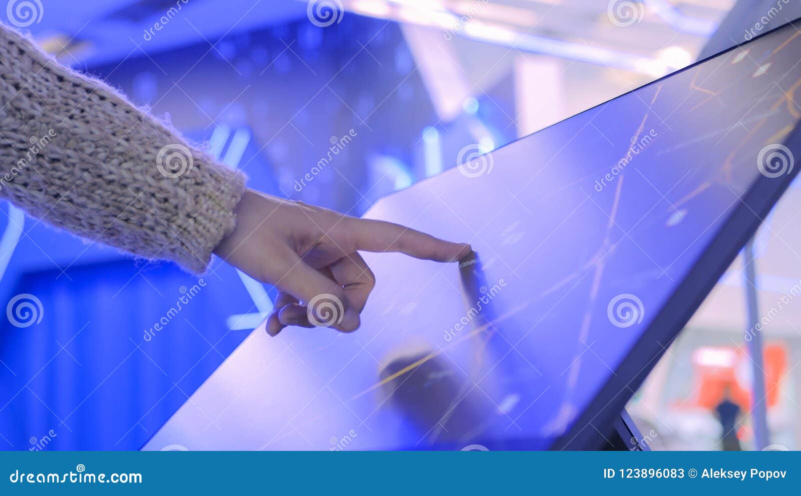 Woman Using Interactive Touchscreen Display at Modern Technology ... Woman Using Interactive Touchscreen Display at Modern Technology ...