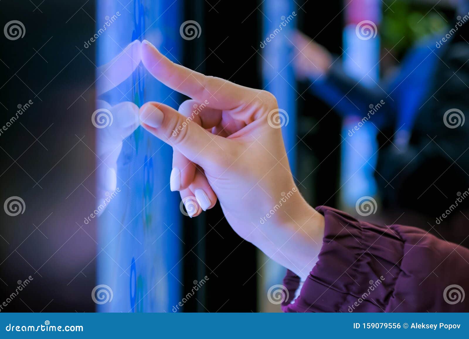 Woman Using Interactive Touchscreen Kiosk with City Map Stock Photo ...