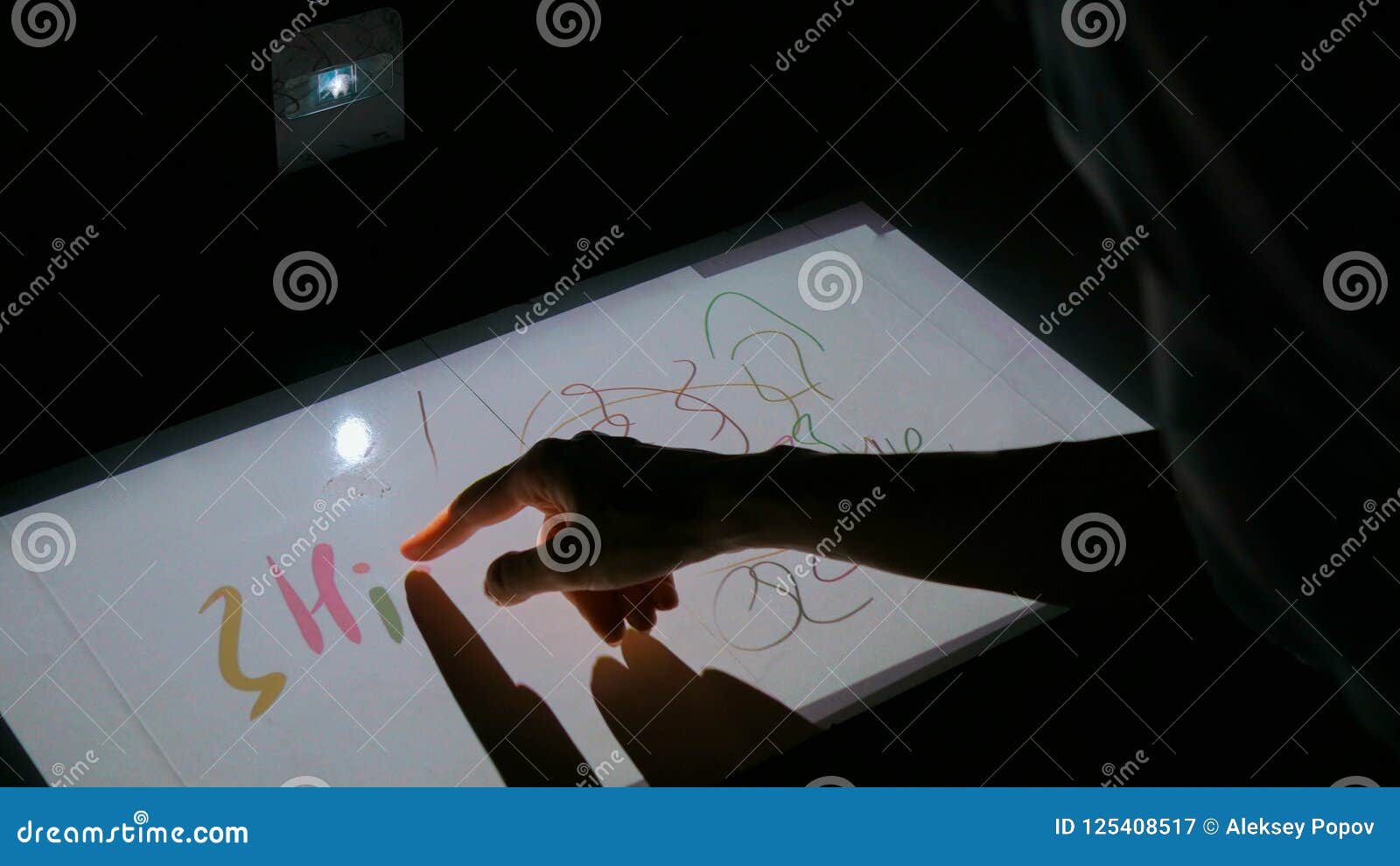 Woman Using Interactive Touchscreen Projector Display for Drawing Stock ...