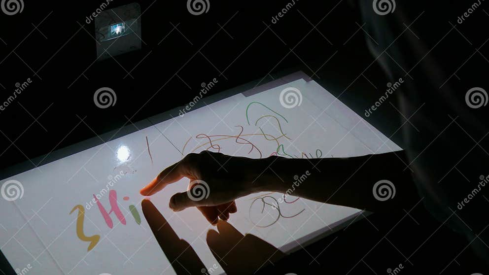 Woman Using Interactive Touchscreen Projector Display for Drawing Stock ...