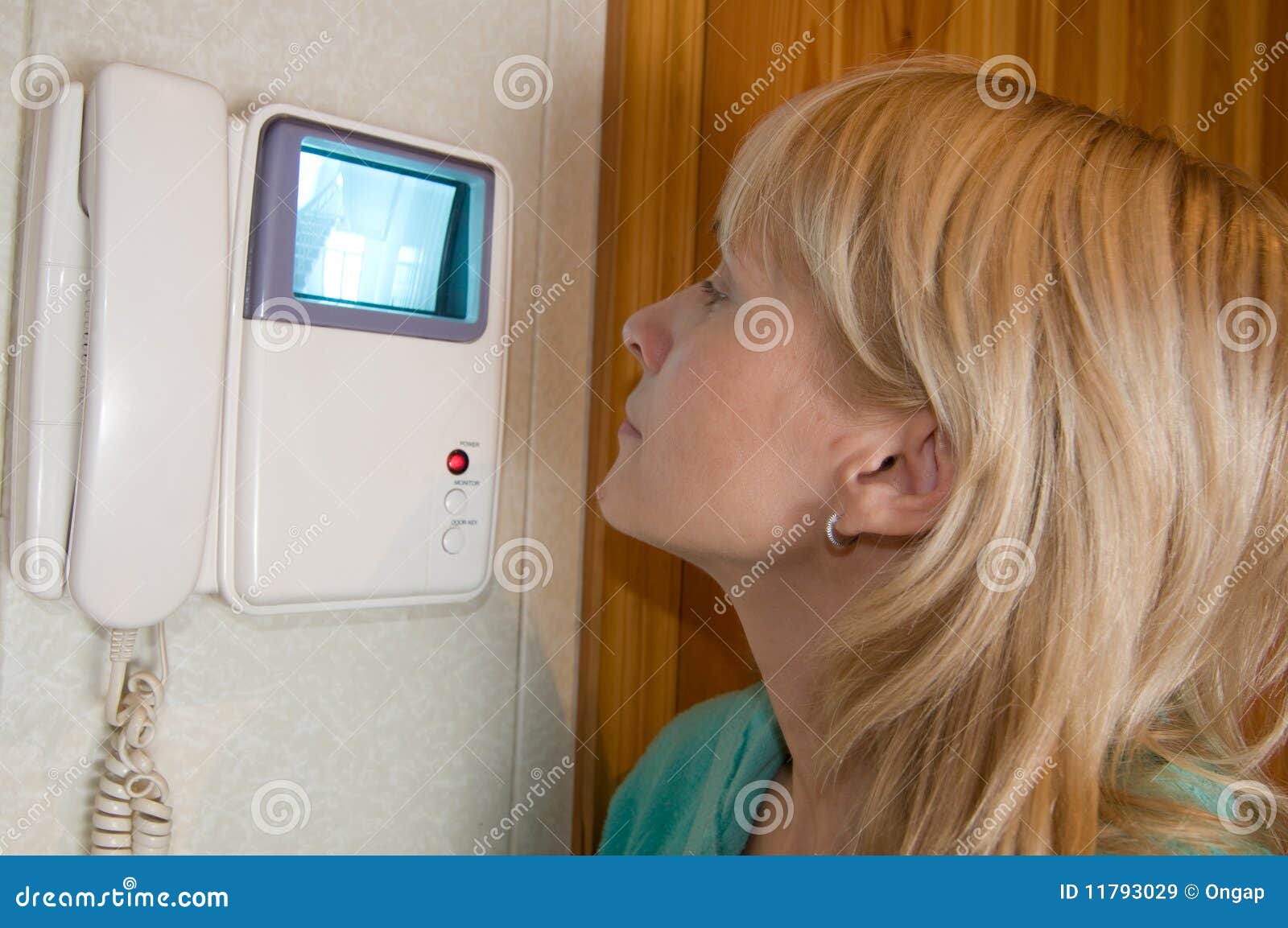 Woman using intercom stock image. Image of phone, communication - 11793029