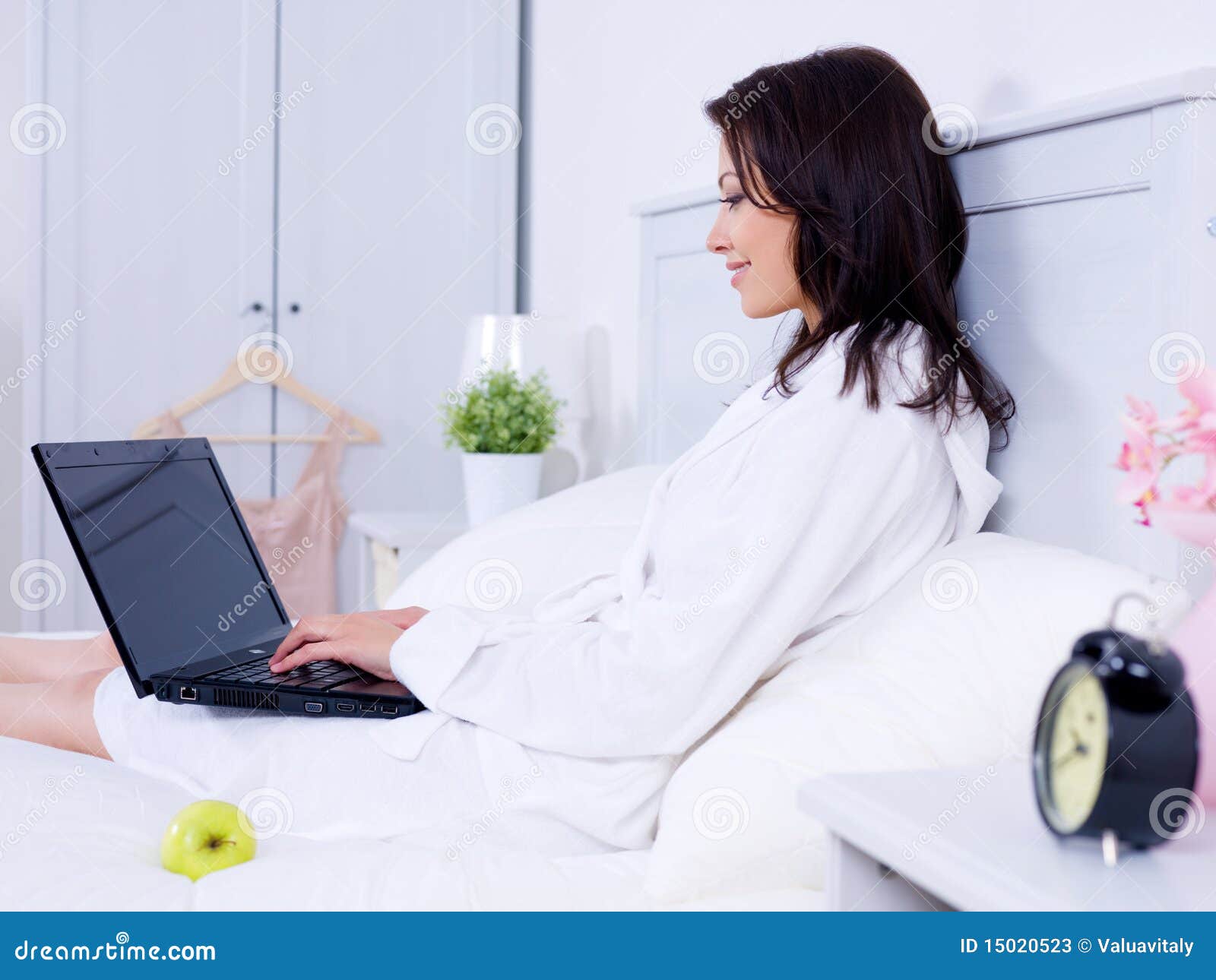 Woman Using Laptop in Bedroom Stock Image - Image of adult, female ...