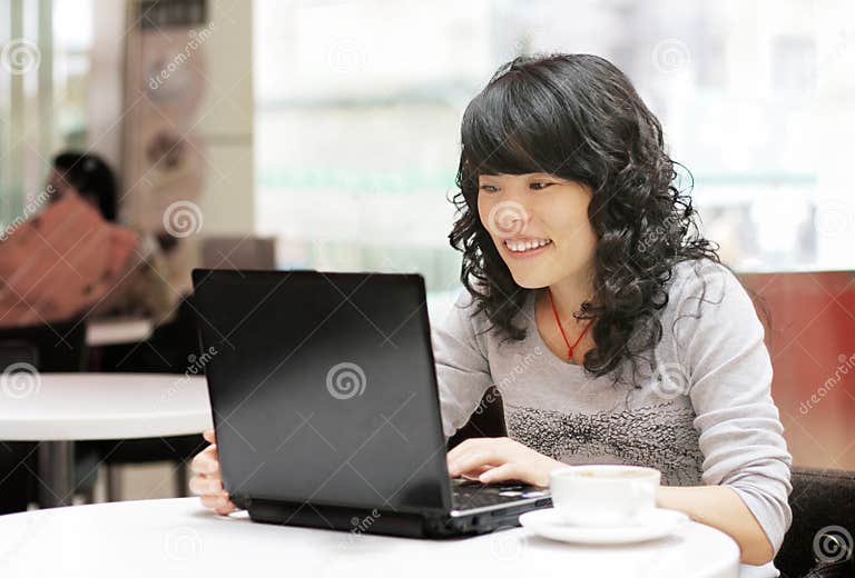 Woman Using a Laptop Computer Stock Photo - Image of lady, pleased ...
