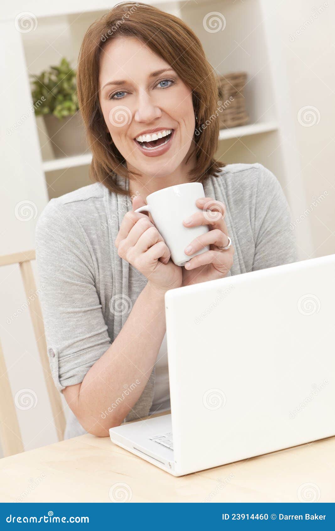 Woman Using Laptop Computer Drinking Tea Coffee Stock Photo - Image of ...