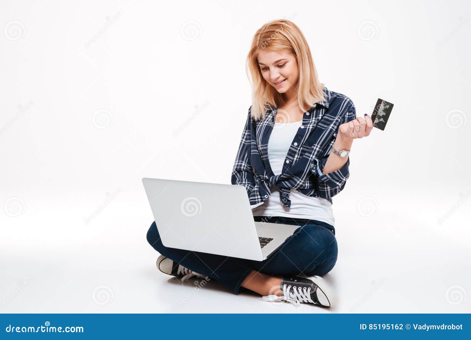 Woman Using Laptop Computer while Holding Debit Card. Stock Photo ...