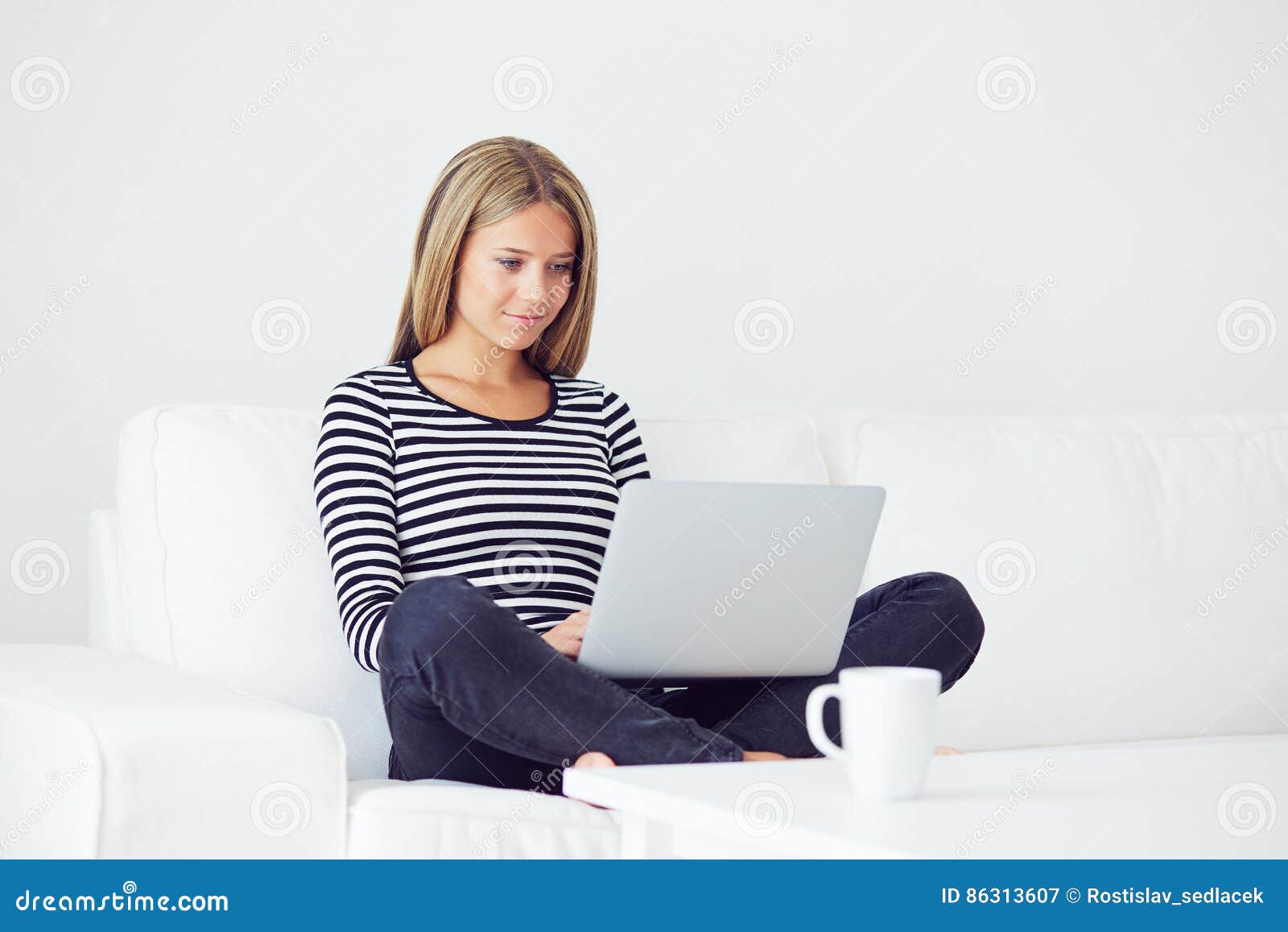 Woman Using Laptop Computer on Sofa Stock Image - Image of computer ...