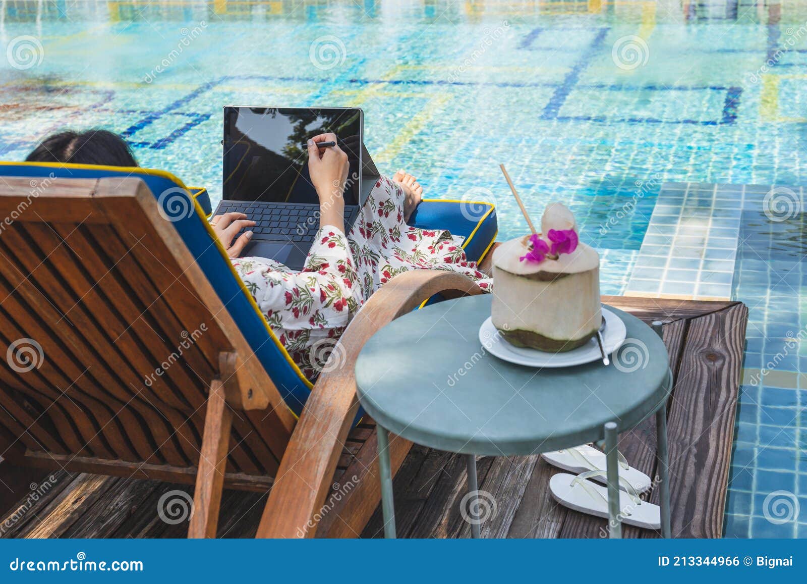 Woman Using Laptop Computer by the Swimming Pool Stock Photo - Image of ...