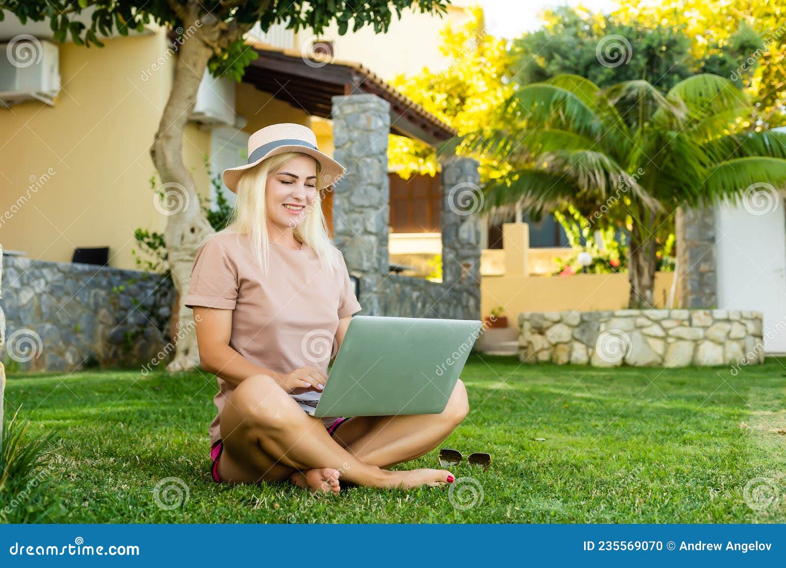 Woman Using Laptop Computer by the Swimming Pool Stock Photo - Image of ...