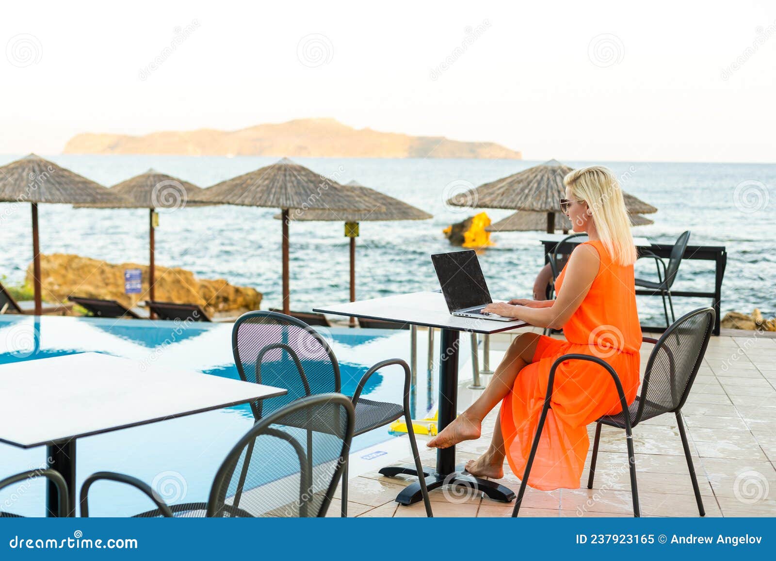 Woman Using Laptop Computer by the Swimming Pool Stock Image - Image of ...
