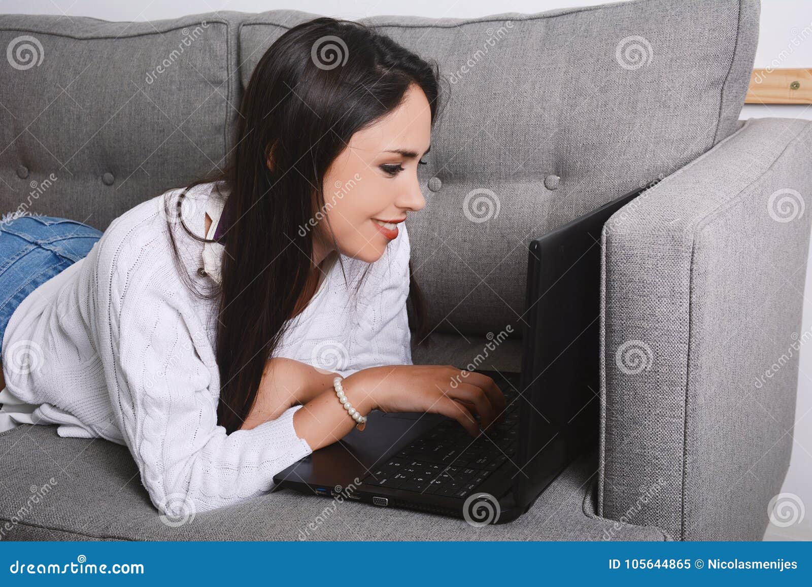 Woman Using Laptop on Couch. Stock Image - Image of computer, laptop ...