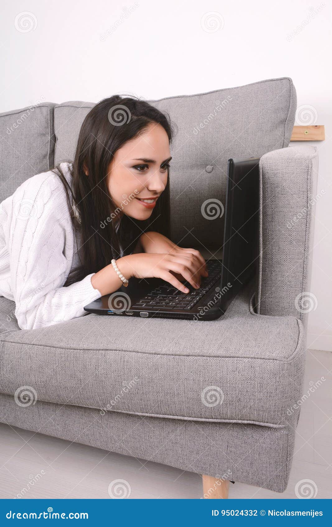 Woman Using Laptop on Couch. Stock Photo - Image of mobility, happy ...