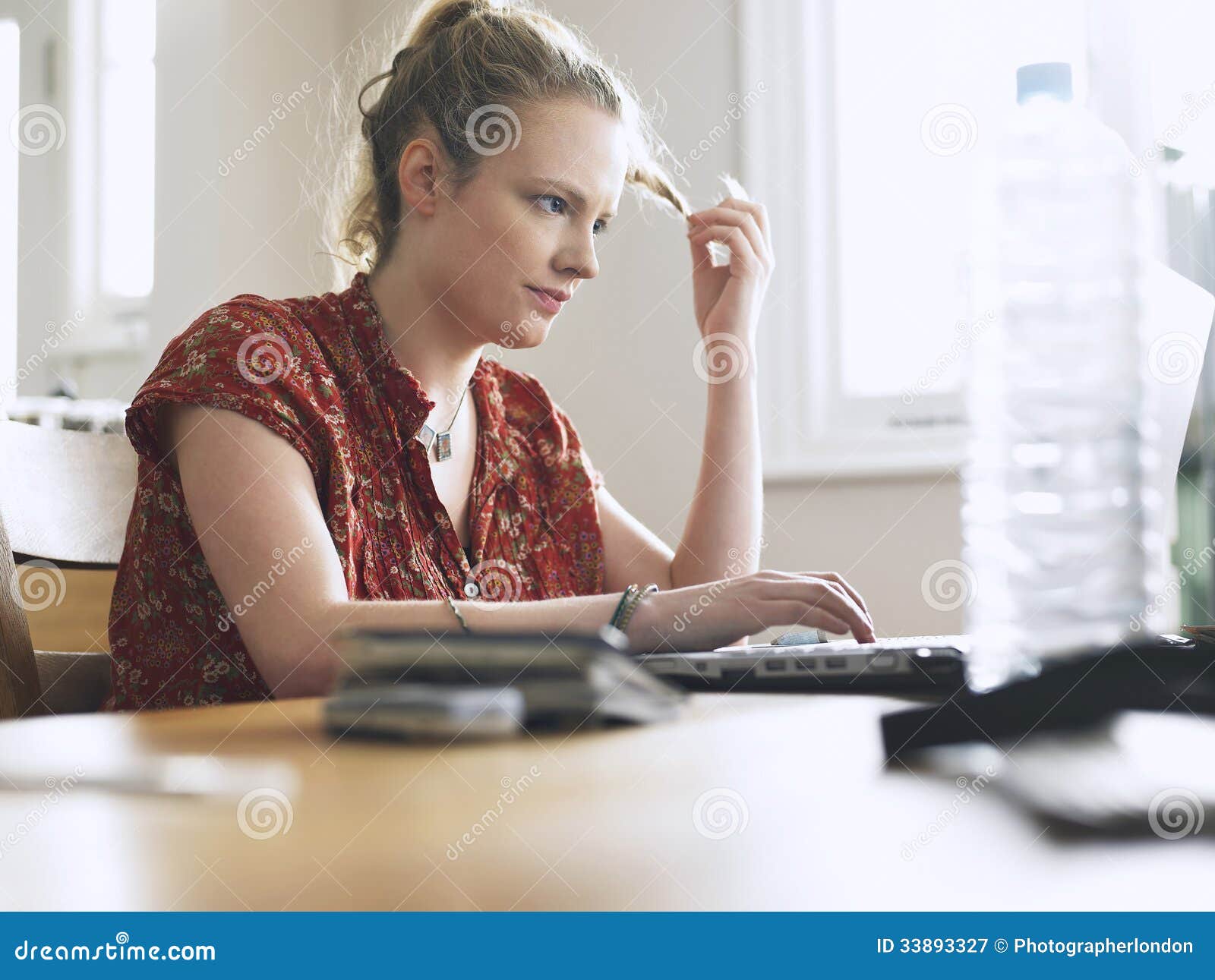 Woman Using Laptop at Dining Table Stock Image - Image of checking ...