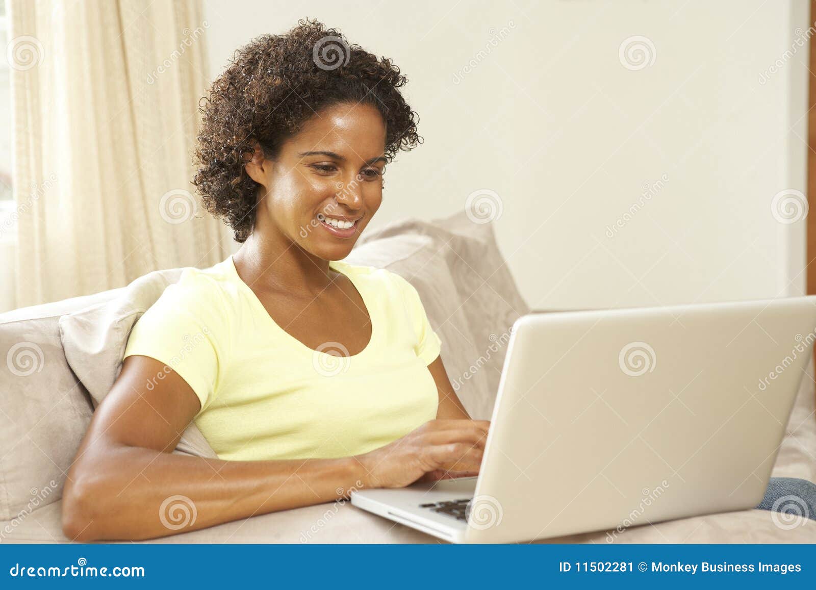 Woman Using Laptop at Home stock image. Image of woman - 11502281