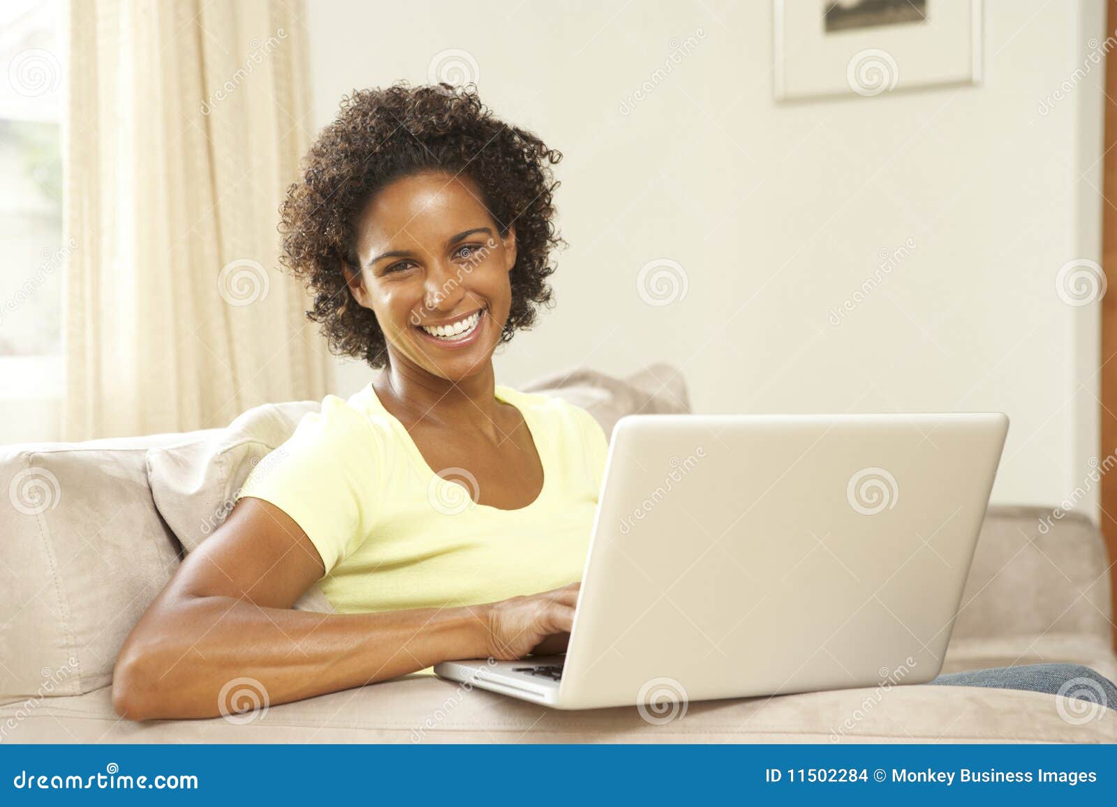 Woman Using Laptop at Home stock photo. Image of living - 11502284