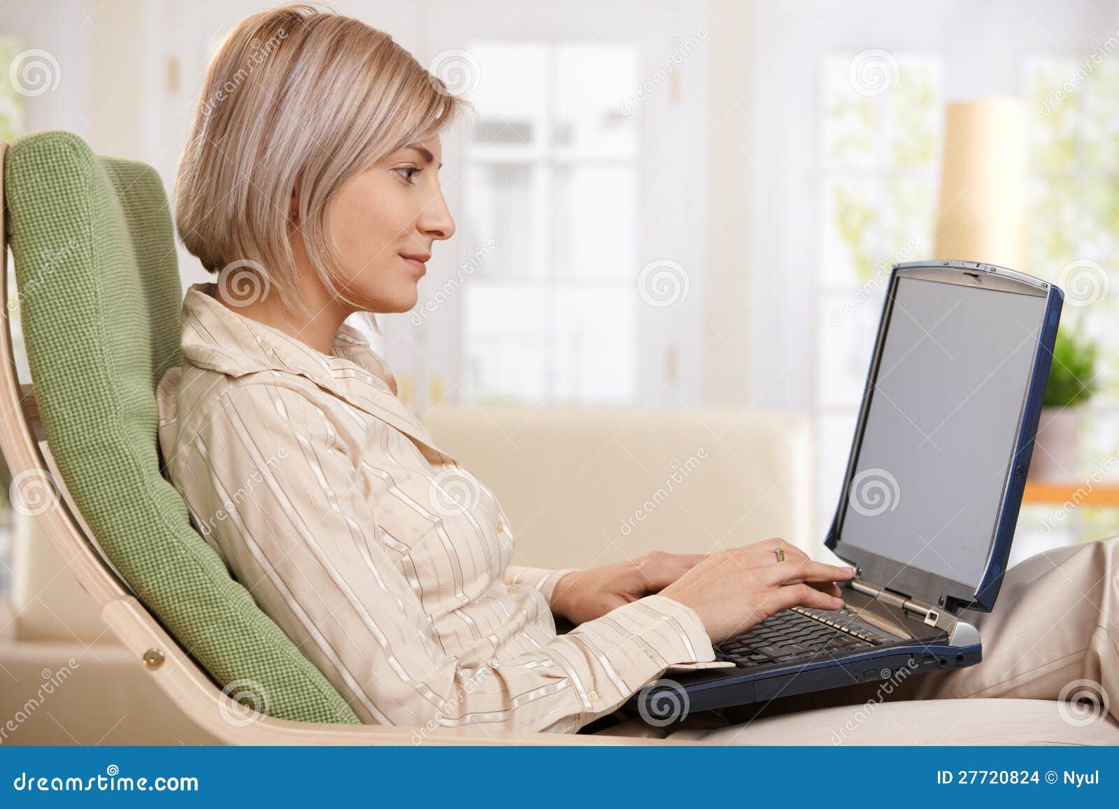 Woman using laptop at home stock photo. Image of closed - 27720824